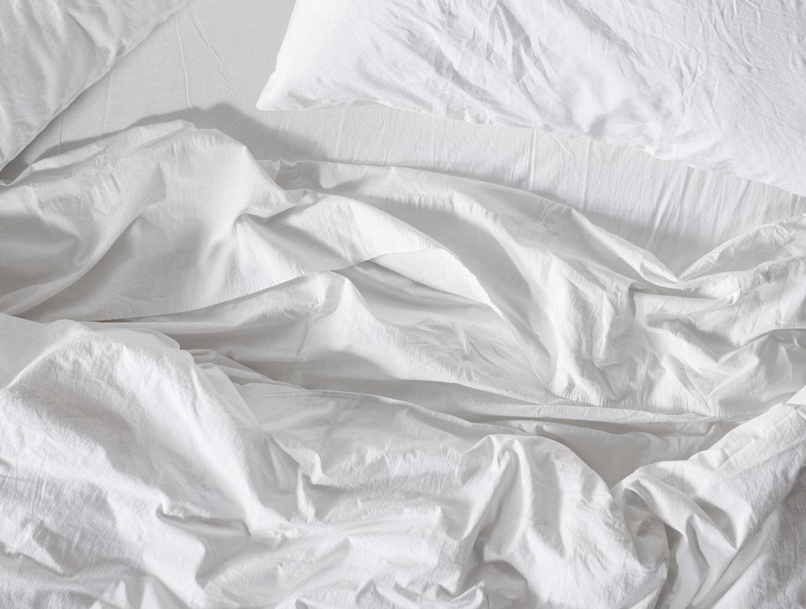 white bed sheets background